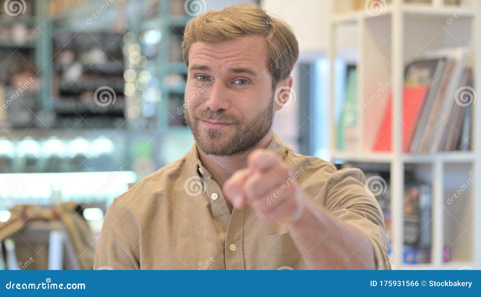 Portrait of Attractive Young Man Pointing with Finger Stock Photo ...