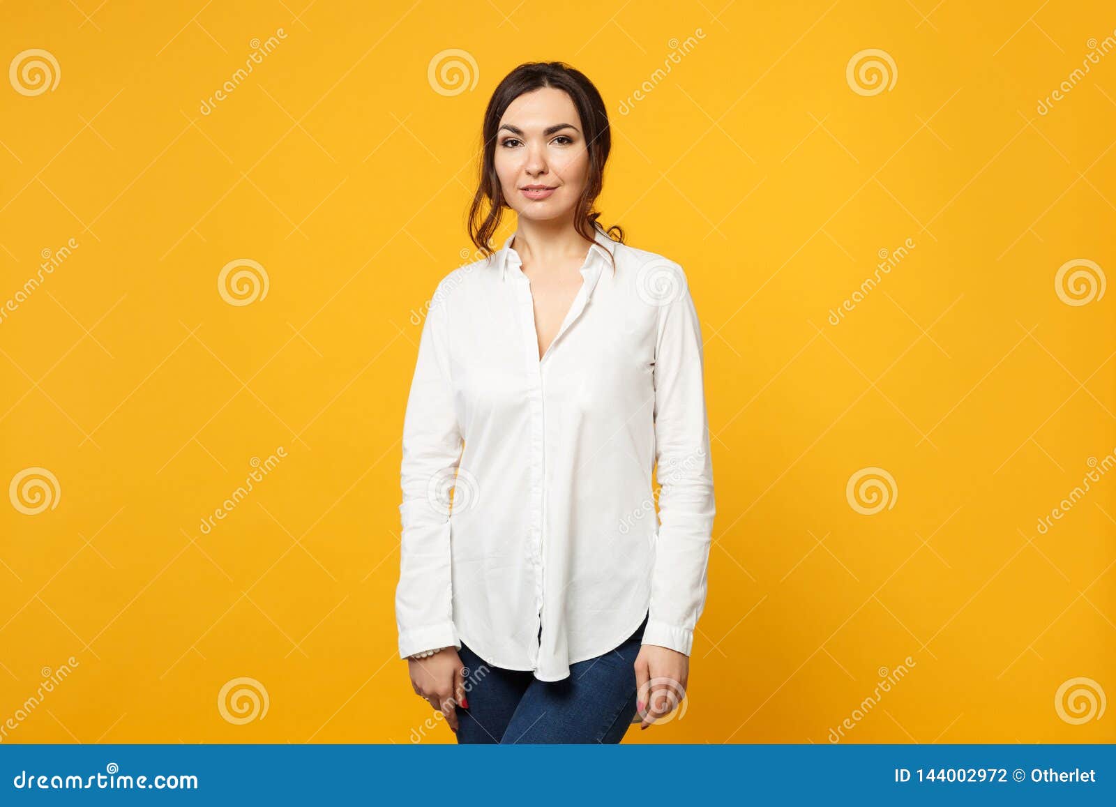 Portrait Of Attractive Young Woman In White Shirt Jeans Standing And