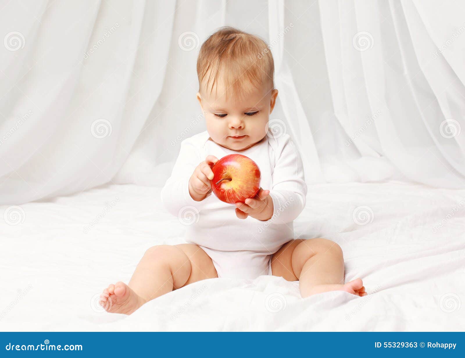 Portrait of Baby Sitting with Red Apple on the Bed Stock Image - Image ...