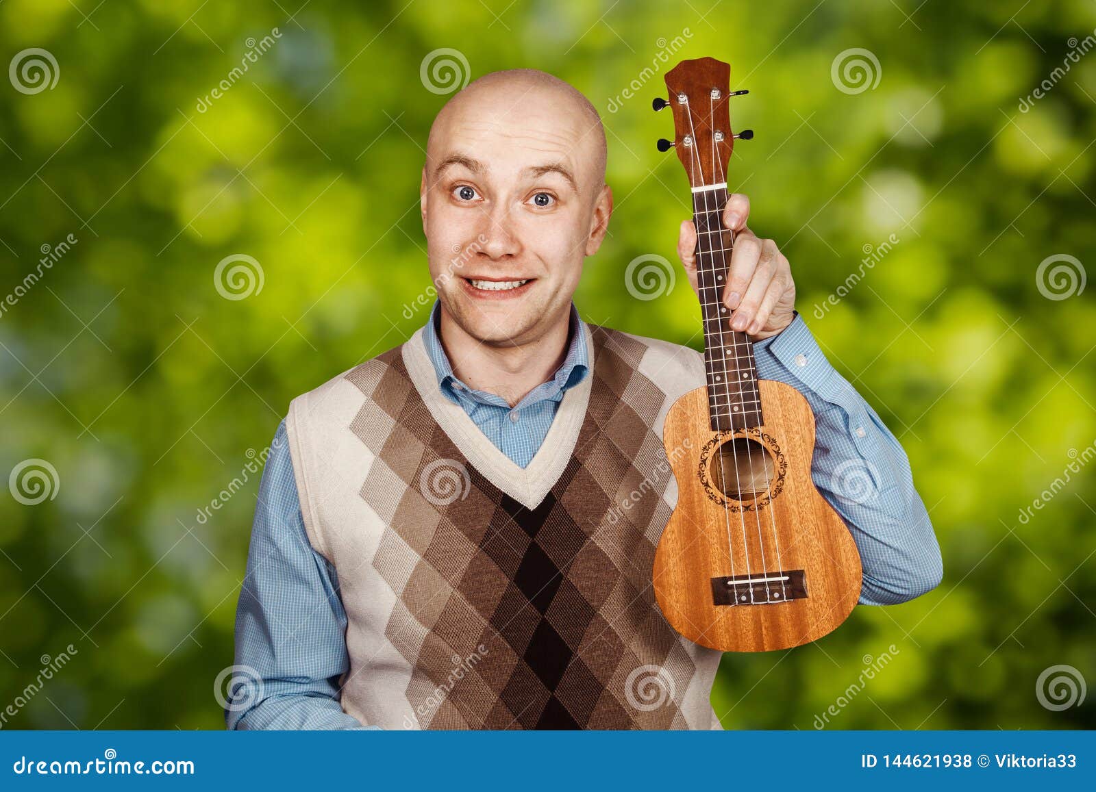 Portrait Bald Man with Ukulele on Green Bokeh Background Stock Photo ...