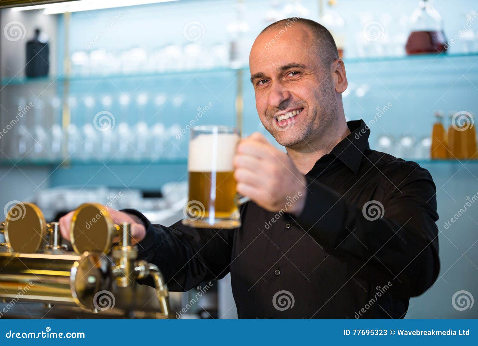 Portrait of Bar Tender Offering Beer Stock Image - Image of confidence ...