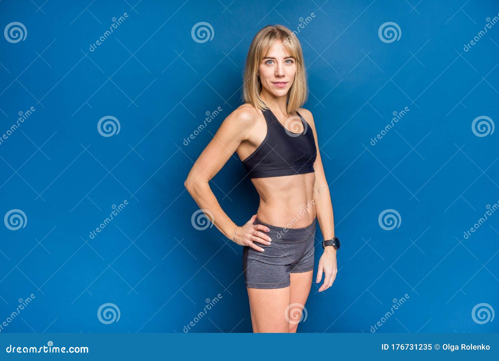 Portrait Of Beautiful Athletic Caucasian Woman In Sport Bra And Shorts
