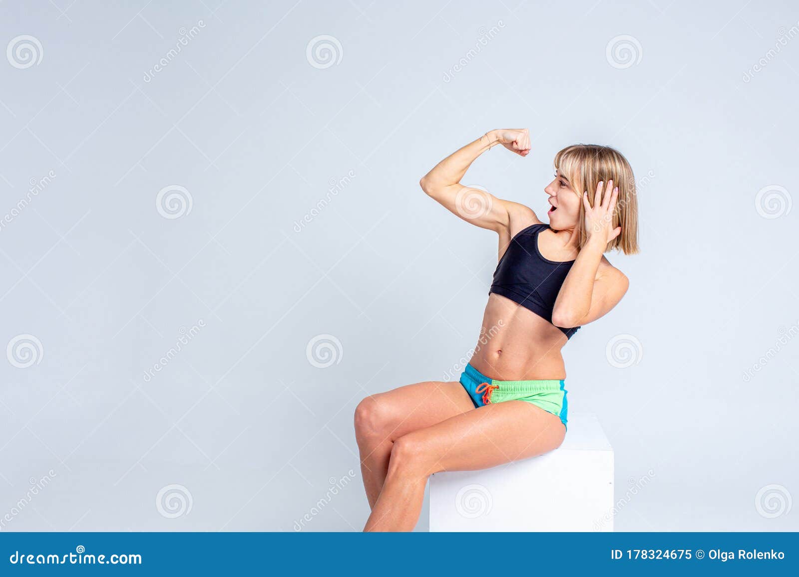 Portrait Of Beautiful Athletic Caucasian Woman In Sport Bra And Shorts