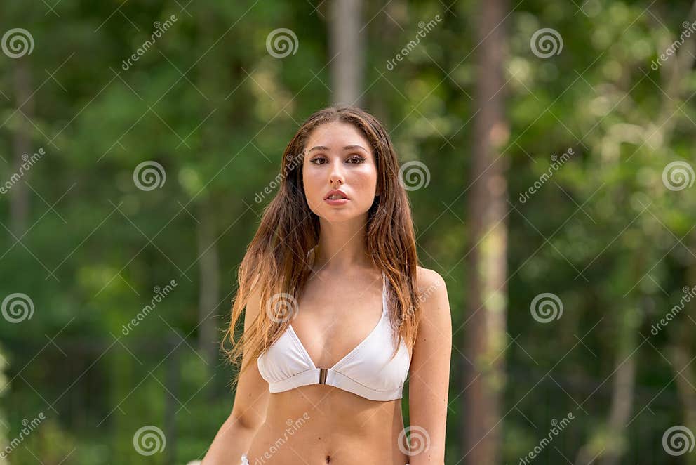 Portrait Of A Beautiful Bikini Model With Blurry Nature Background
