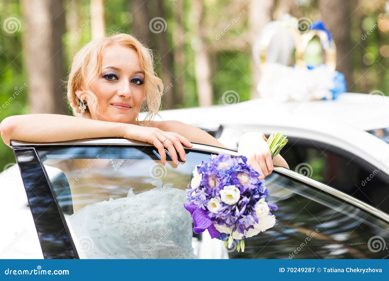 Portrait of a Beautiful Blonde Bride with the Wedding Car. Stock Image ...