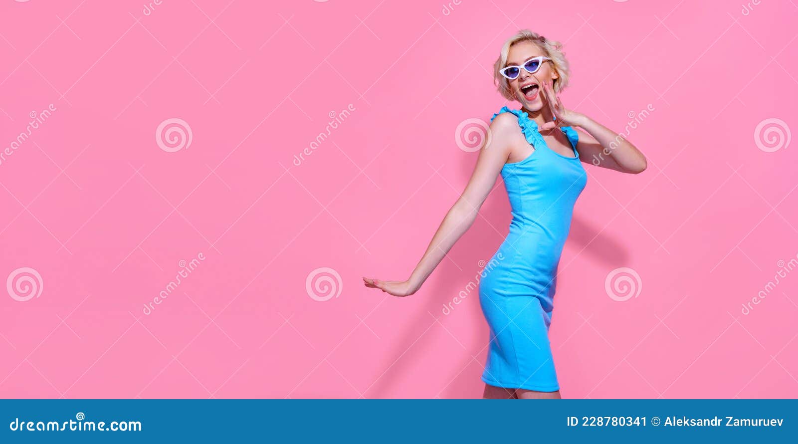 Portrait Of Beautiful Blonde Woman In Blue Dress With Sunglasses Posing