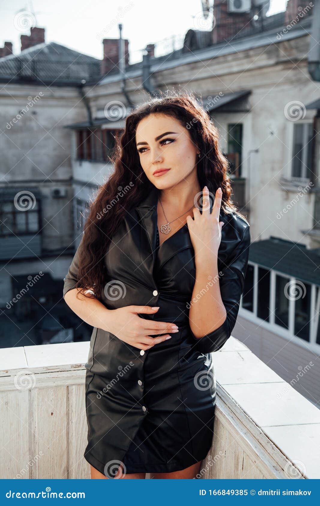 Portrait Of A Beautiful Fashionable Brunette Woman In A Black Leather