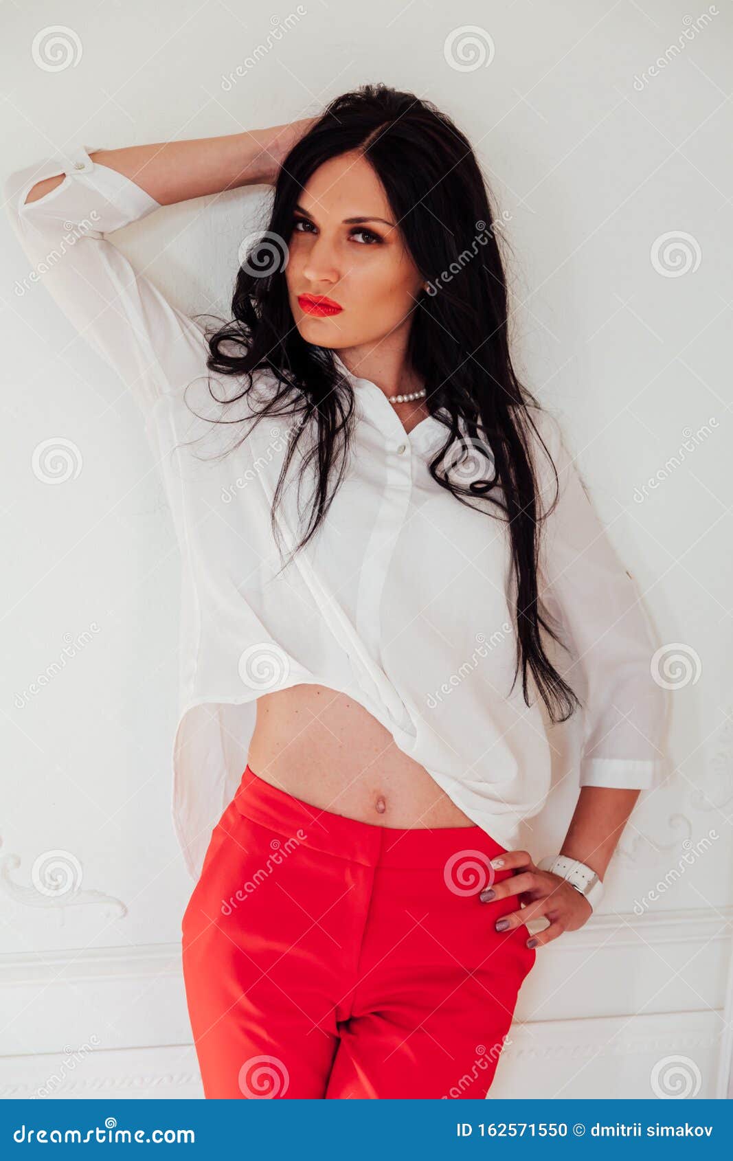 Portrait of a Beautiful Business Woman in a Red Business Suit in the ... Portrait of a Beautiful Business Woman in a Red Business Suit in the ...