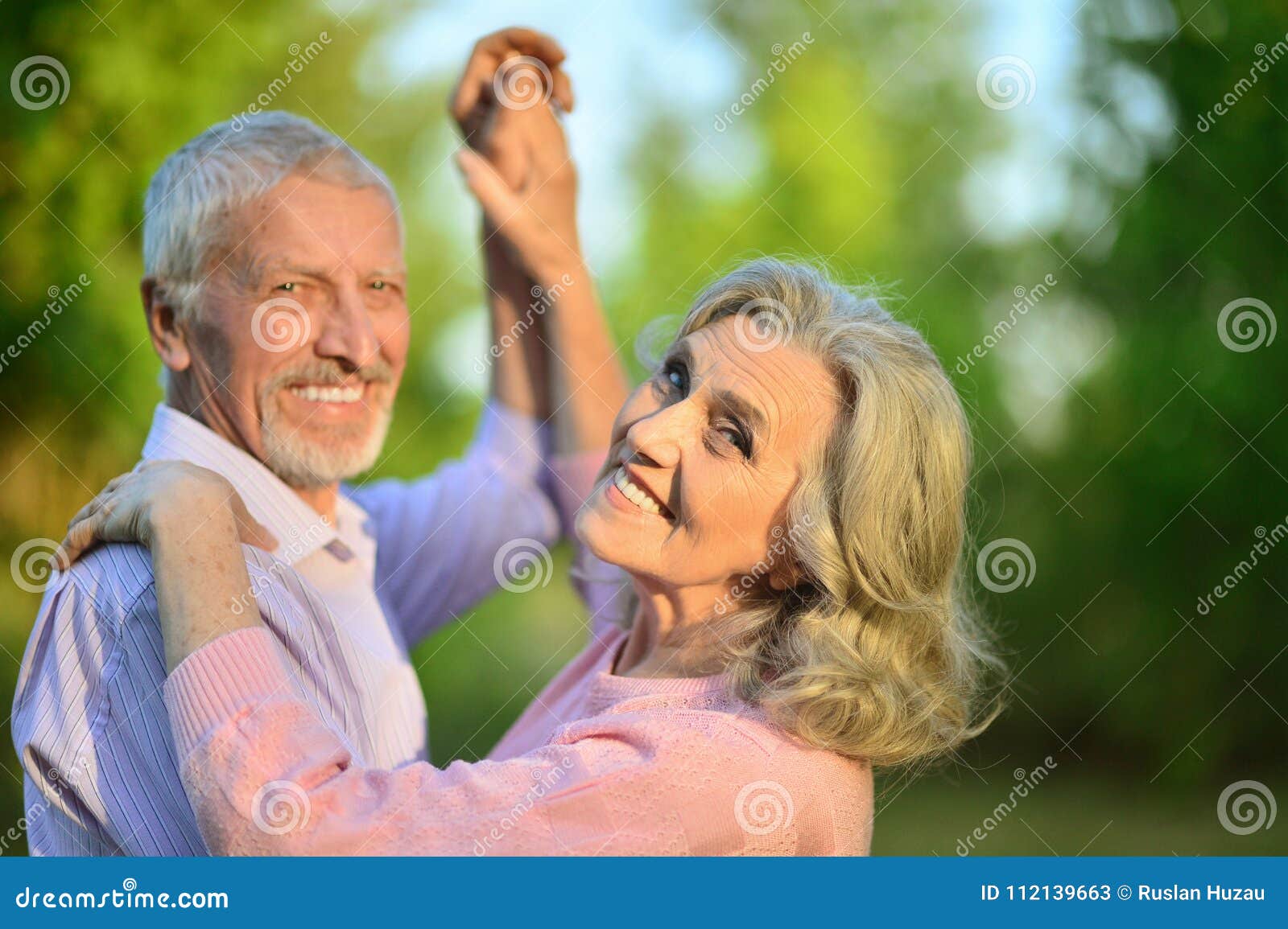 Portrait Of Beautiful Caucasian Senior Couple In The Park Danci Stock