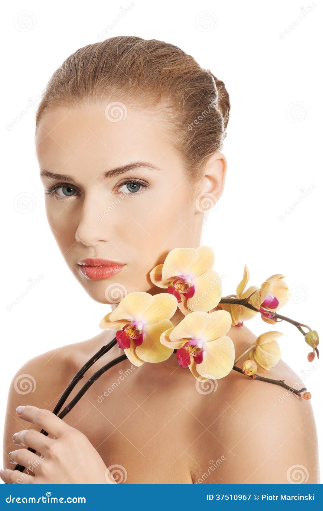 Portrait Of Beautiful Caucasian Woman With Orchid Flower Stock Image
