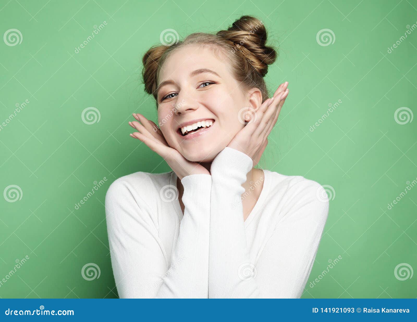 Portrait Of Beautiful Cheerful Girl Smiling Laughing Looking At Camera