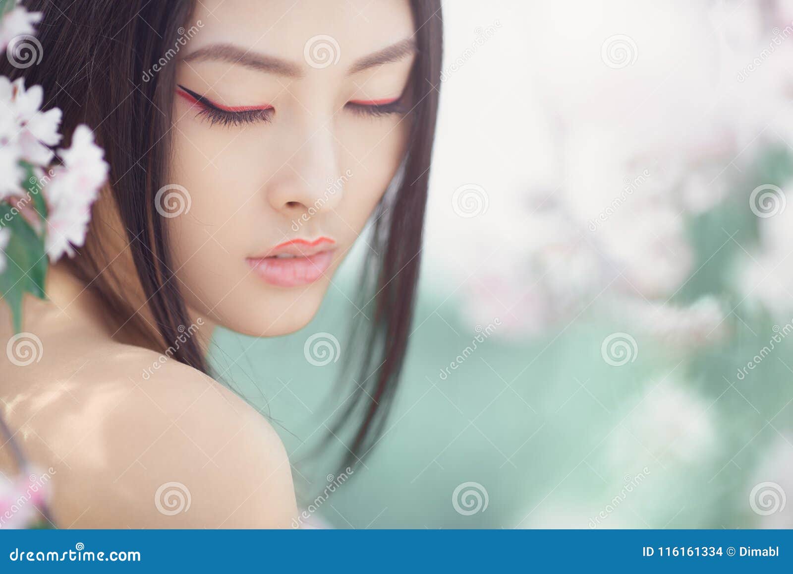 Portrait Of A Beautiful Fantasy Asian Girl Outdoors Against Natural Spring Flower Background 6459
