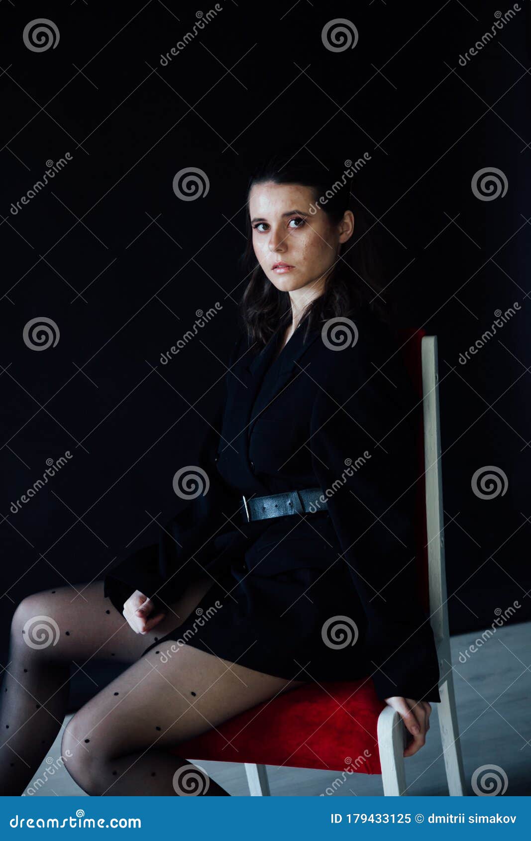 Portrait Of A Beautiful Fashionable Brunette Woman In A Black Business