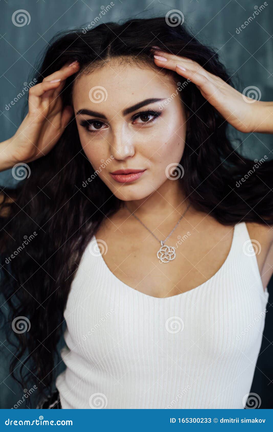 Portrait Of A Beautiful Fashionable Brunette Woman On A White