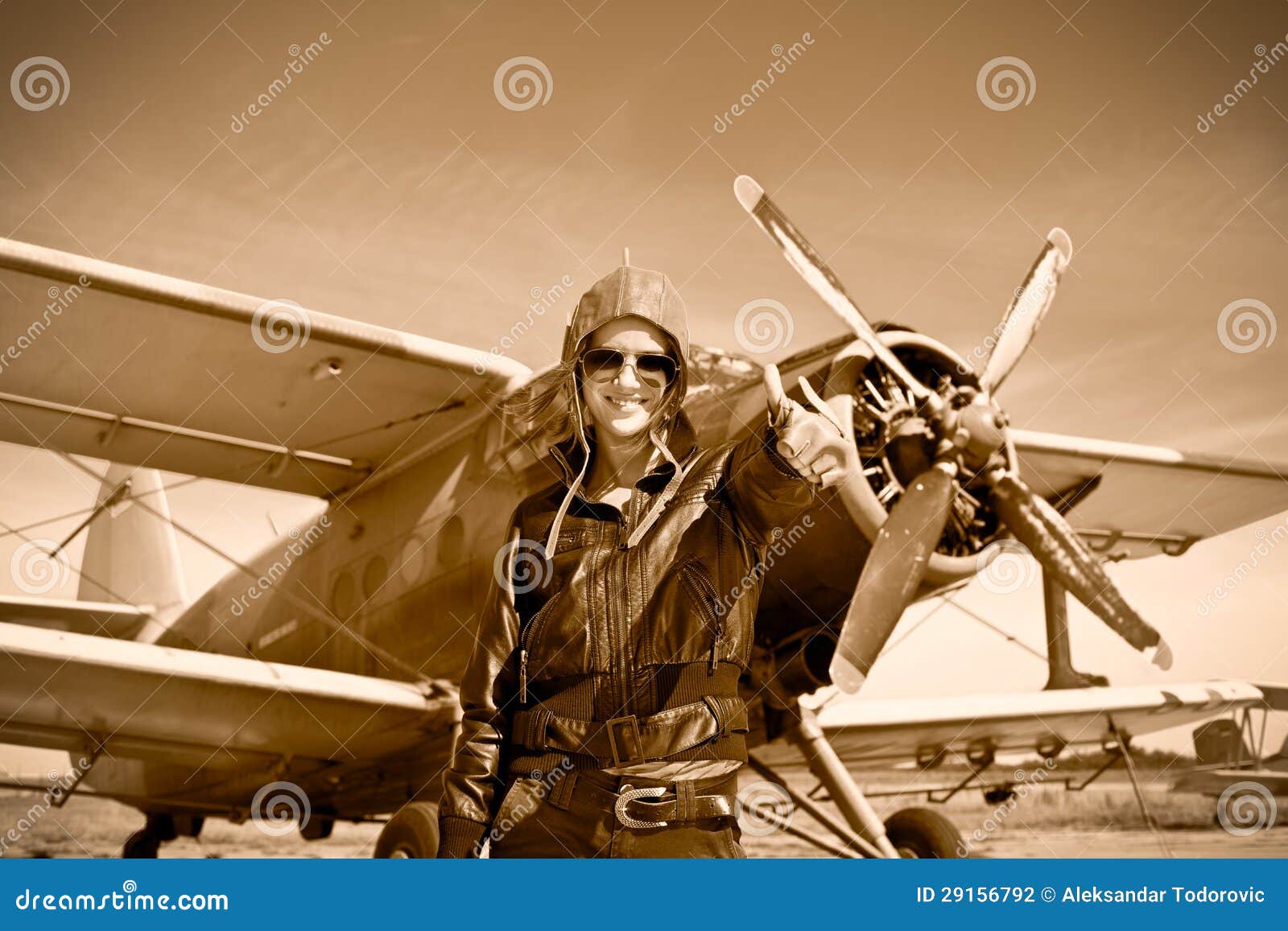 Portrait of Beautiful Female Pilot with Plane Behind. Stock Photo ...
