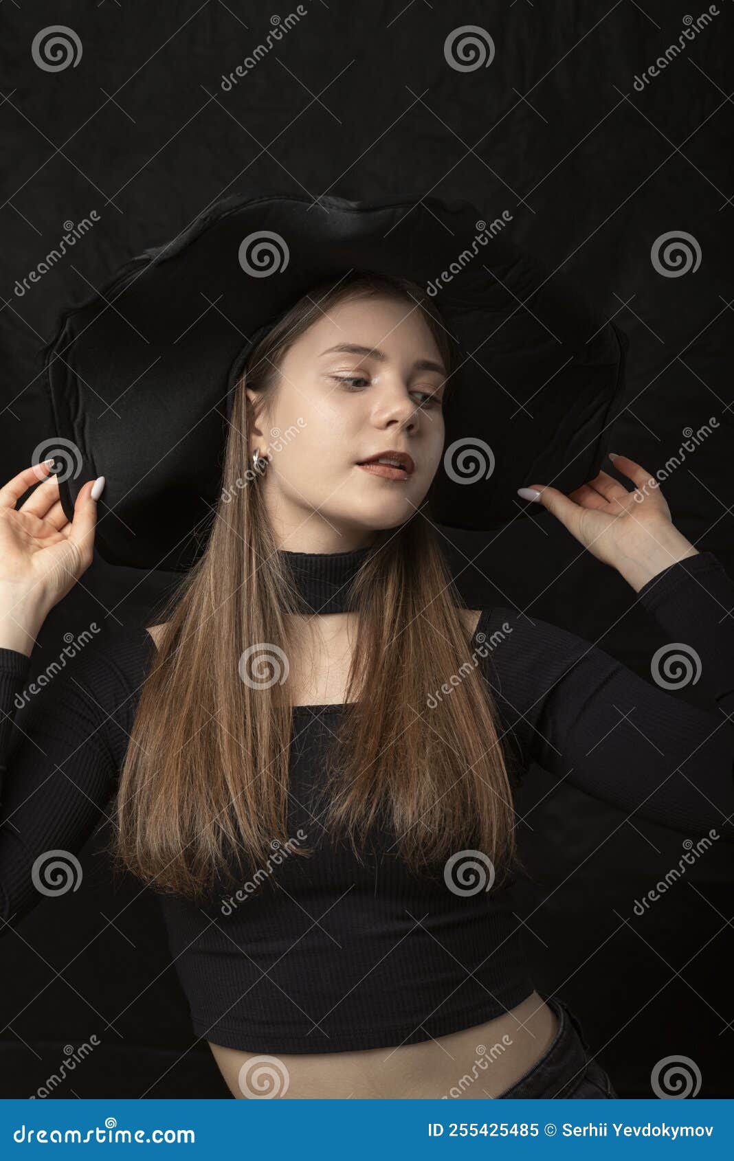 Portrait of Beautiful Girl in Black Top and Wide-brimmed Hat. Stylish ... Portrait of Beautiful Girl in Black Top and Wide-brimmed Hat. Stylish ...