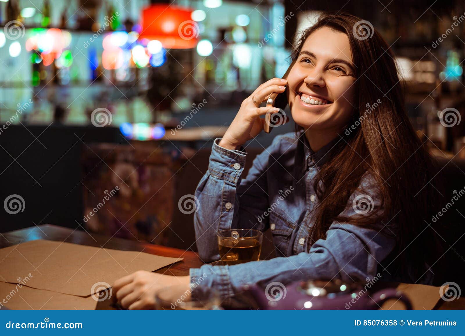 Portrait of Beautiful Girl Using Her Mobile Phone in Cafe. Stock Photo ...