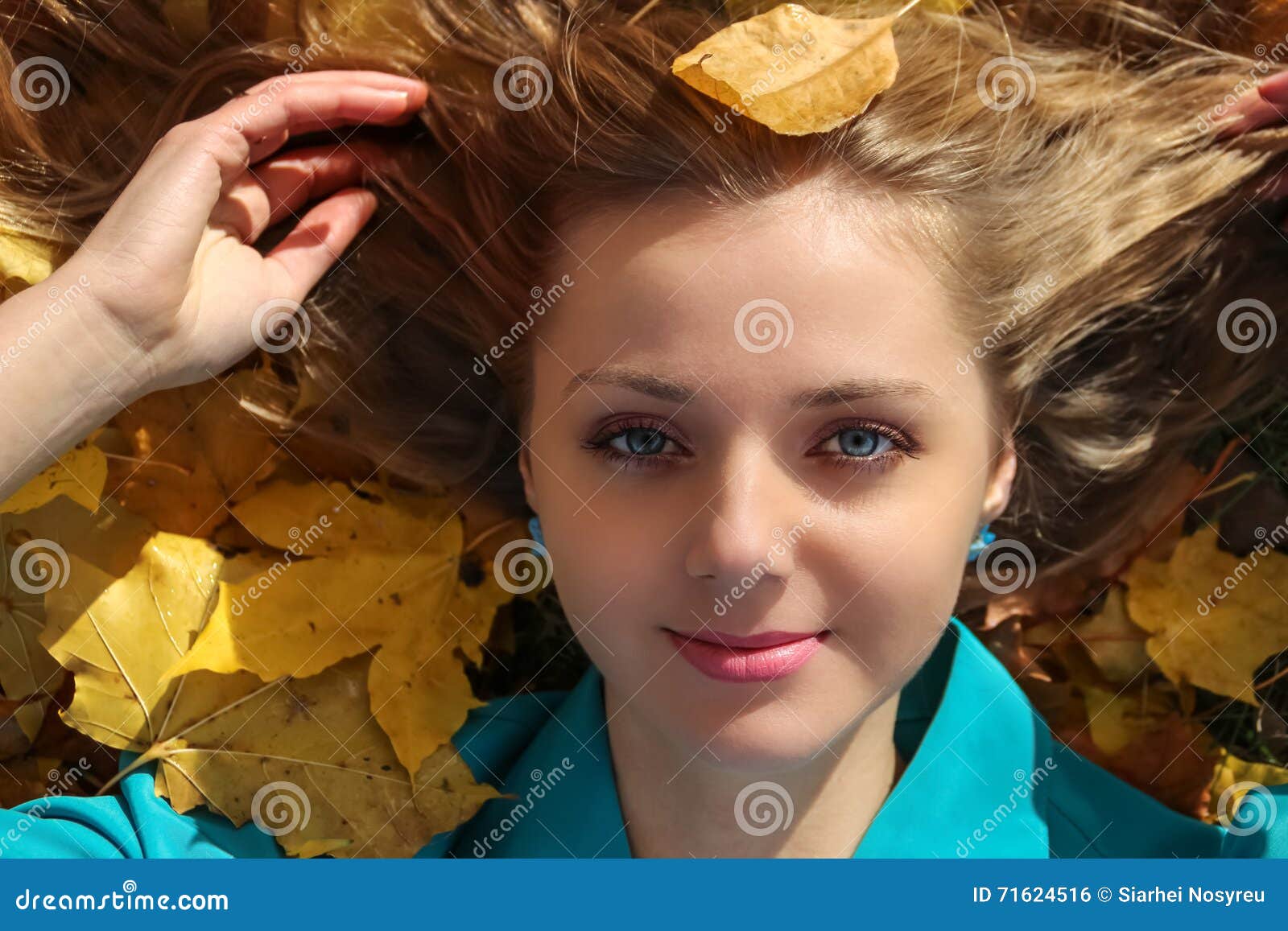 Portrait Of Beautiful Girl Which Lying On Grass With Yellow Maple