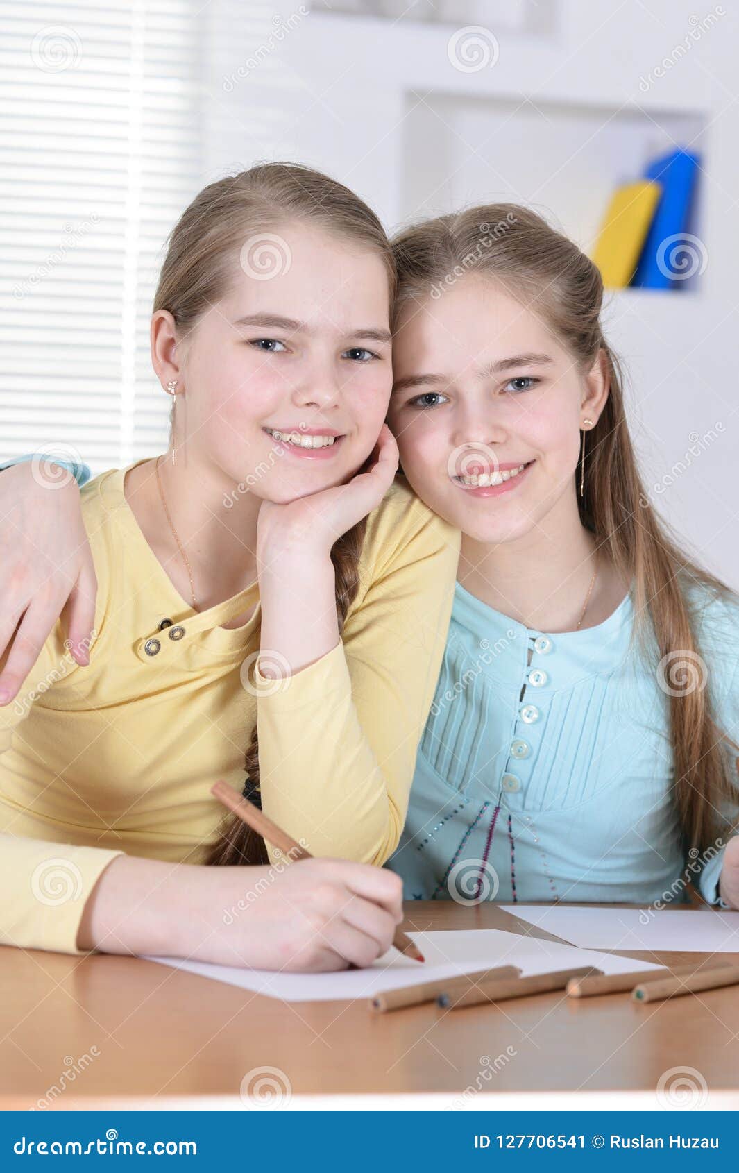 Portrait of Beautiful Girls Doing Homework at Table Stock Image - Image ...