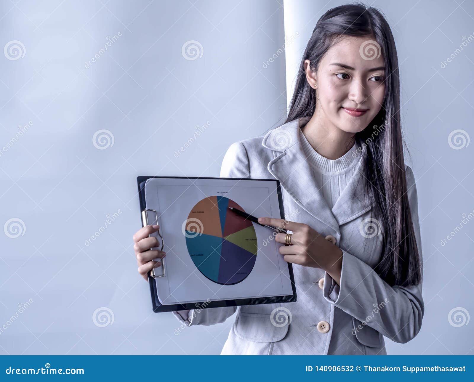 Portrait of Beautiful Intern Standing at Office in Front of Flip Chart ...