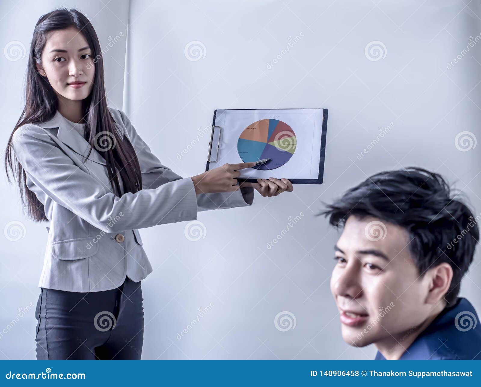 Portrait of Beautiful Intern Standing at Office in Front of Flip Chart ...