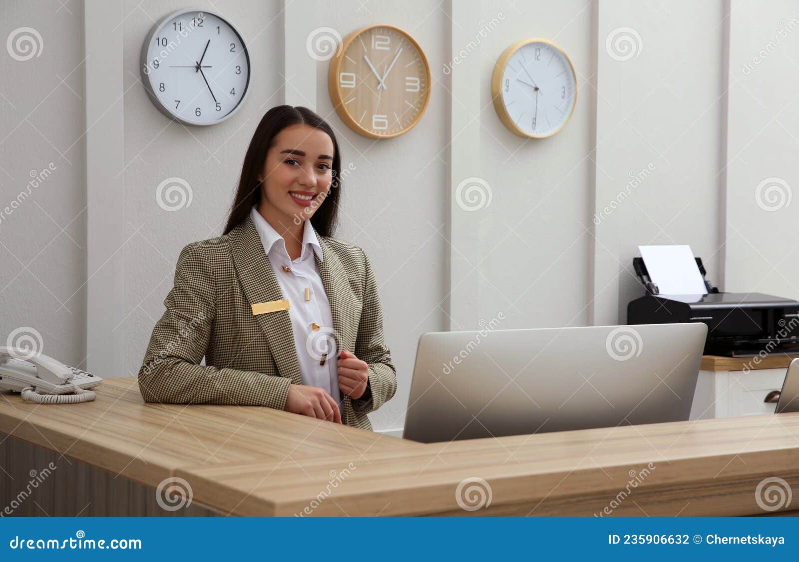 Portrait of Beautiful Receptionist at Counter in Hotel Stock Photo ...
