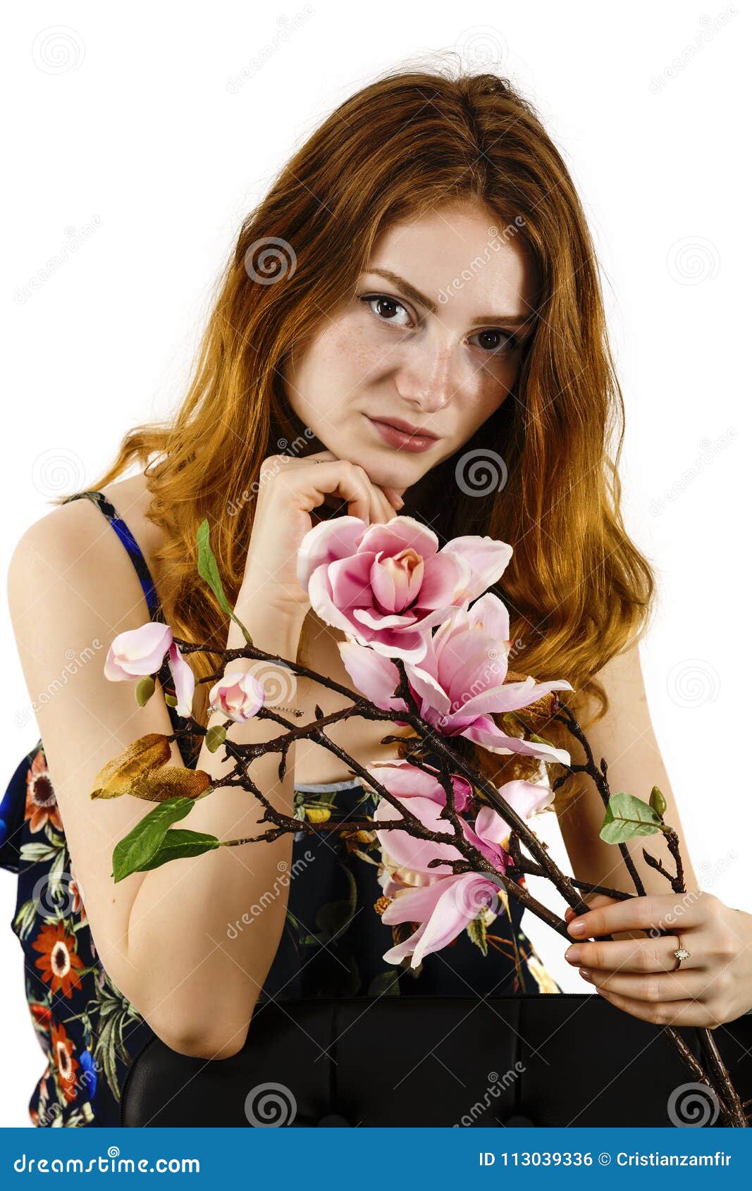 Portrait Of A Beautiful Red Haired Woman Holding A Flower In Her Stock
