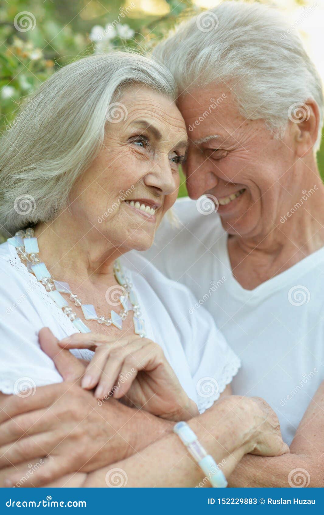 Portrait Of Beautiful Senior Couple Hugging In The Park Stock Image