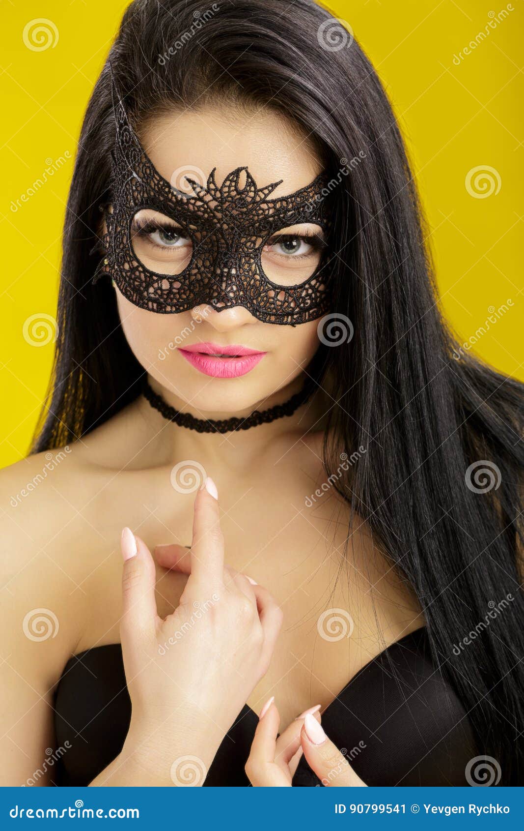 Portrait Of Beautiful Sensual Woman In Black Lace Mask On Yellow