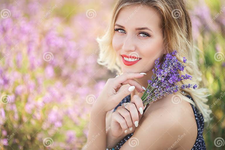 Portrait Of Beautiful Girl Sitting In Lavender Field Stock Image