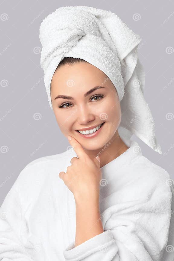 Portrait Of A Beautiful Smiling Woman With Clean Skin In A White