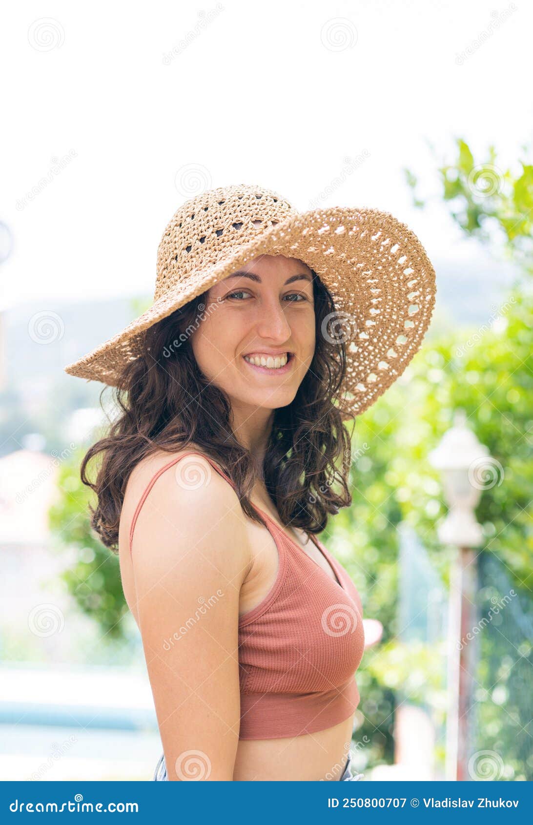 Portrait Of Beautiful Smiling Woman In Wide Brim Straw Hat Stock Image