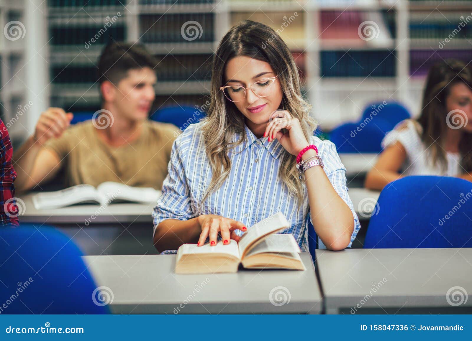 Portrait of a Beautiful Student in a Library Stock Photo - Image of ...