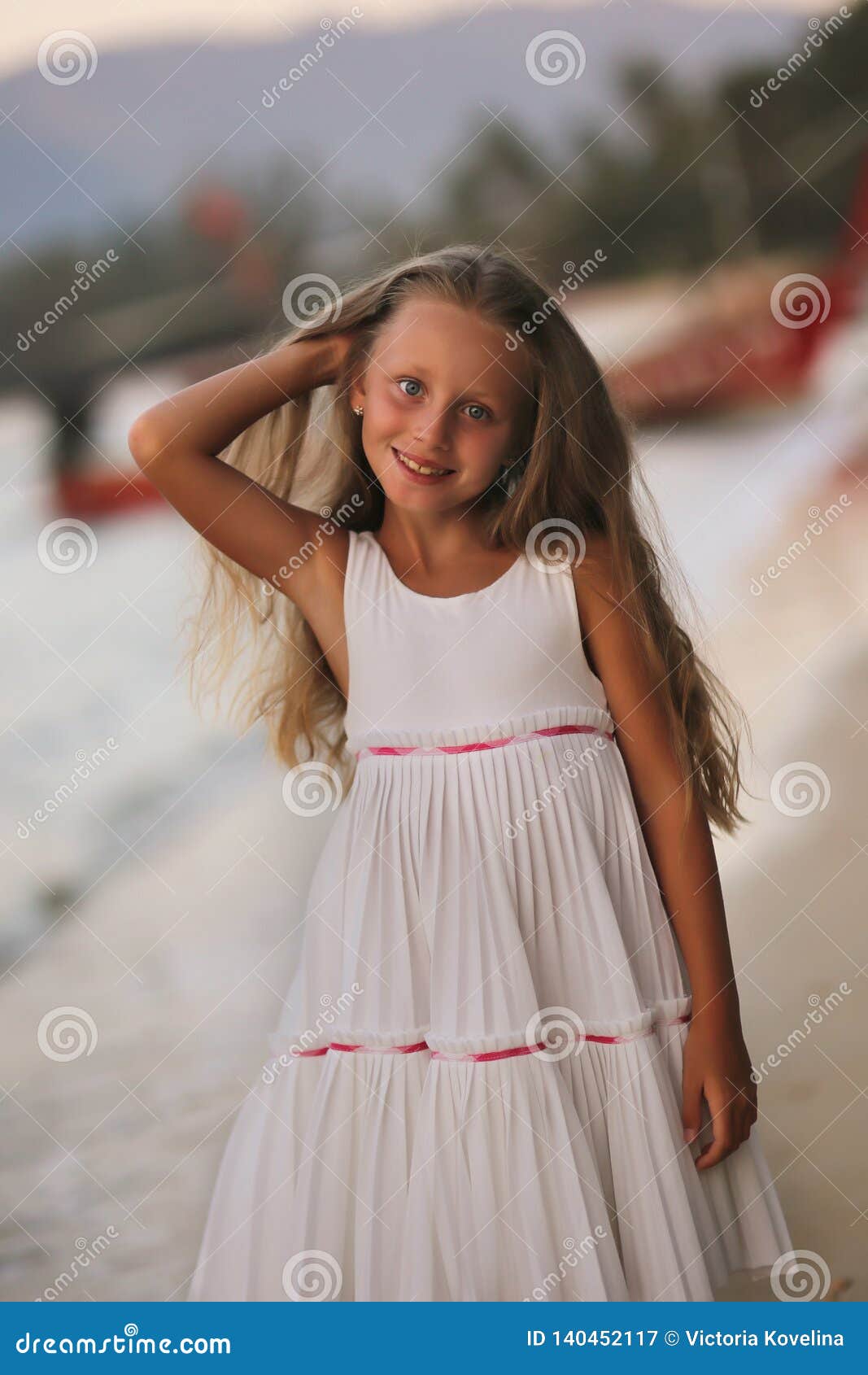 Portrait Of A Beautiful Sweet Girl With Long Hair Walking Along The