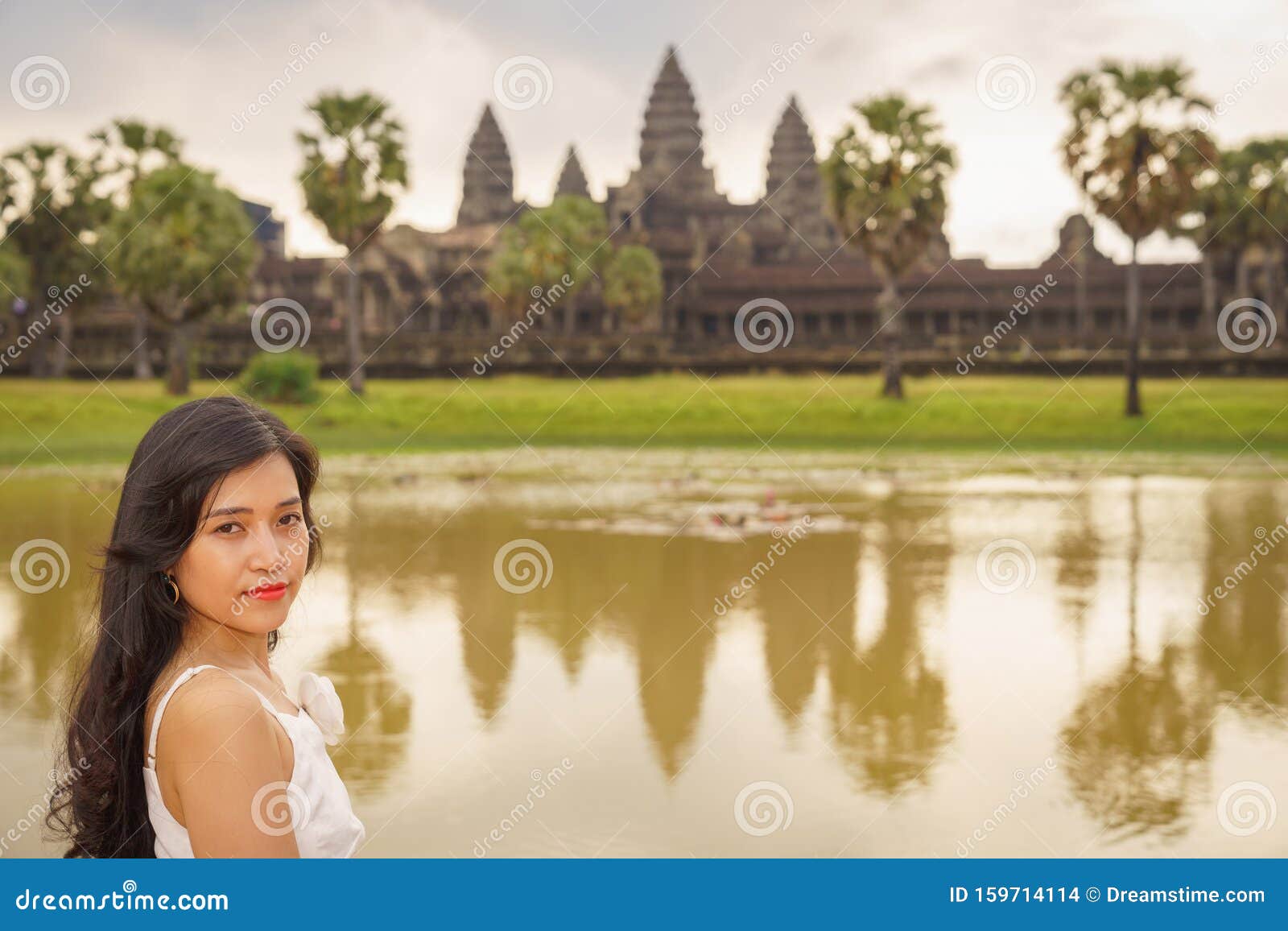Portrait Of Beautiful Vietnamese Millennial Girl Posing Next To Angkor