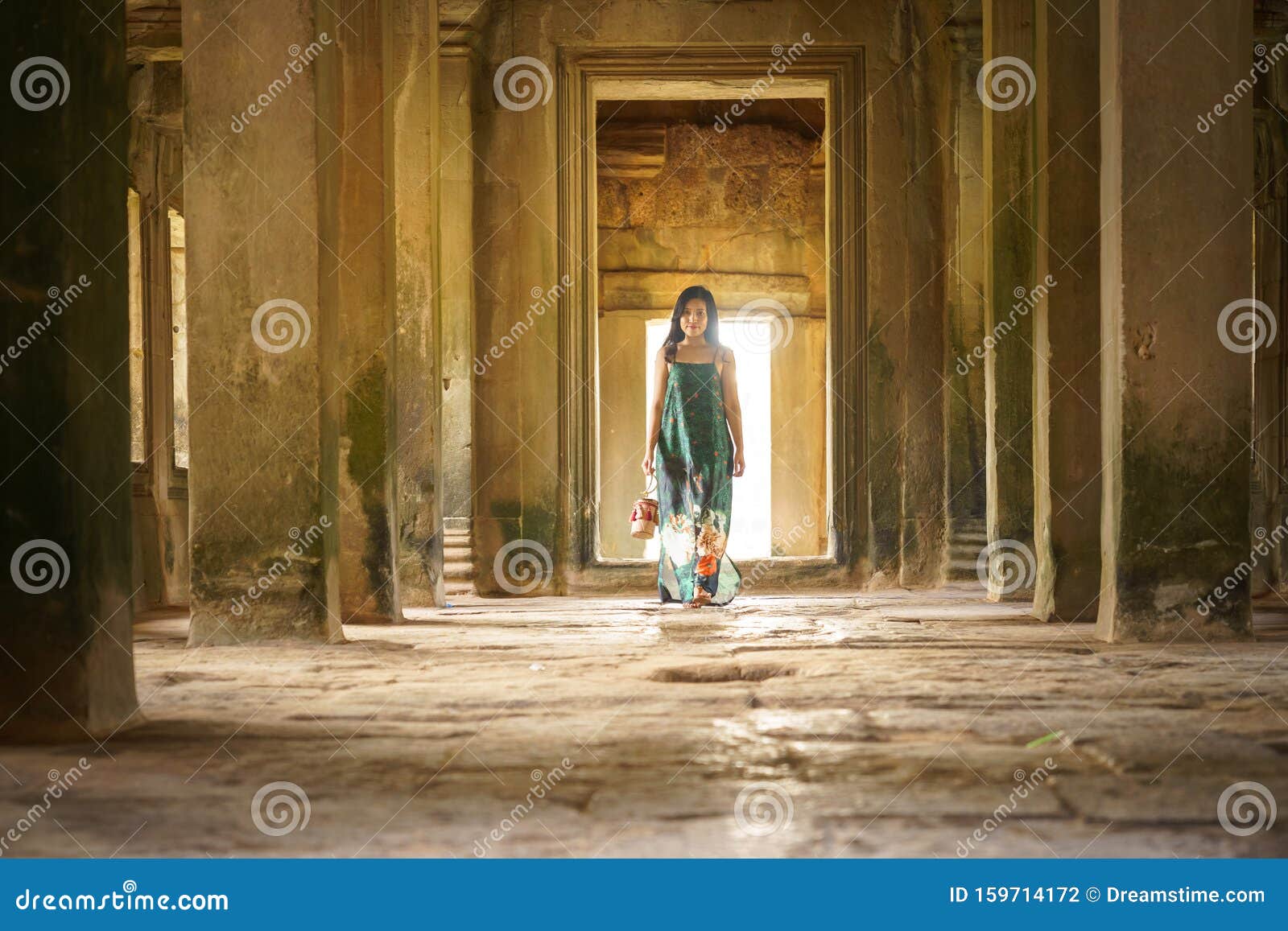 Portrait Of Beautiful Vietnamese Millennial Girl Posing Next To Angkor