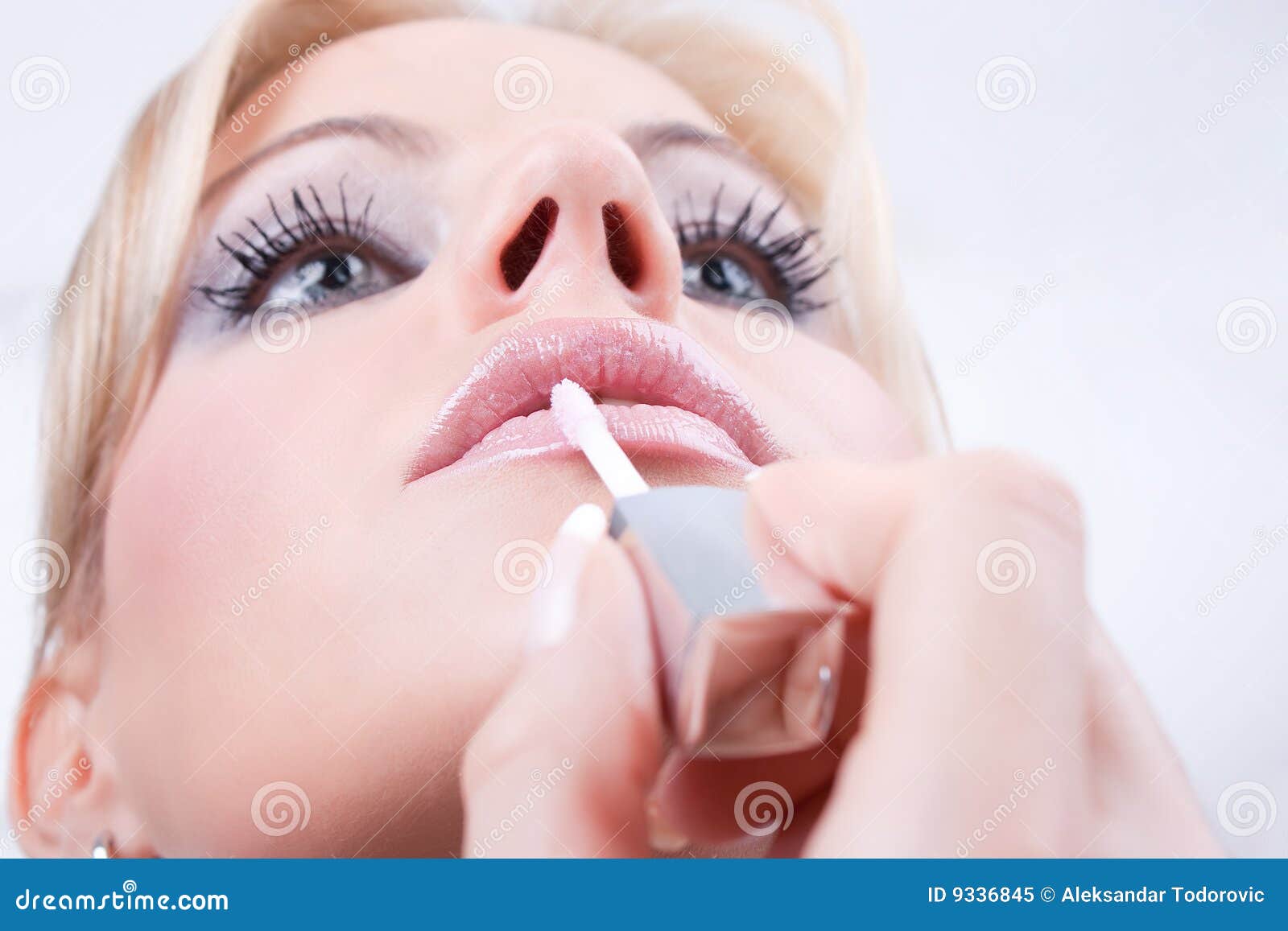 Portrait of a Beautiful Woman Applying Makeup Stock Image - Image of ...