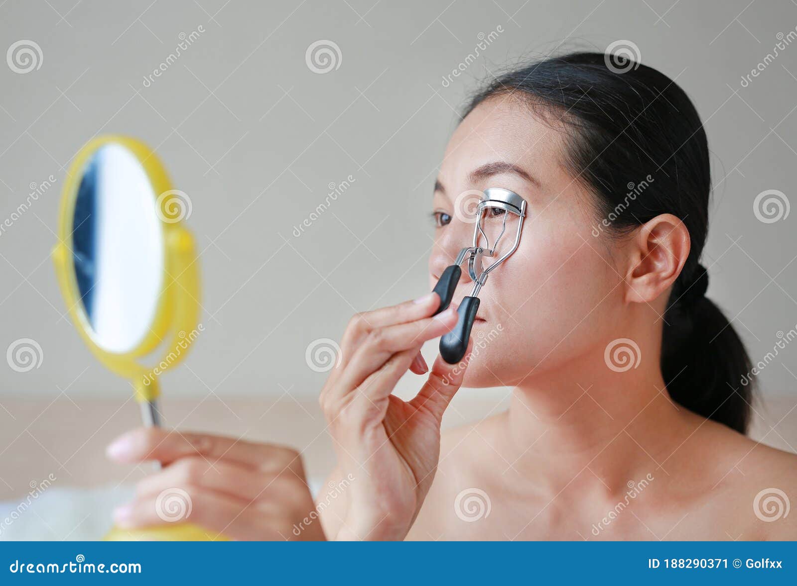 Portrait Of Beautiful Woman Making Curl Eyelashes Beauty Concept Stock