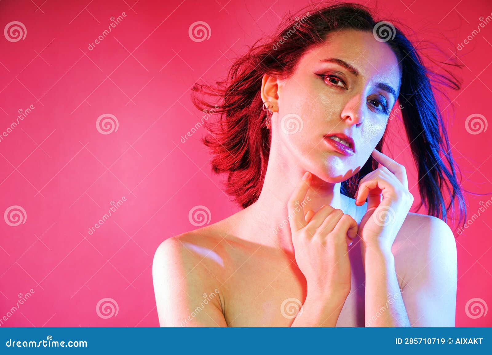 Portrait of a Beautiful Woman Posing Strapless in Front of Pink Background in Studio Stock Image ...