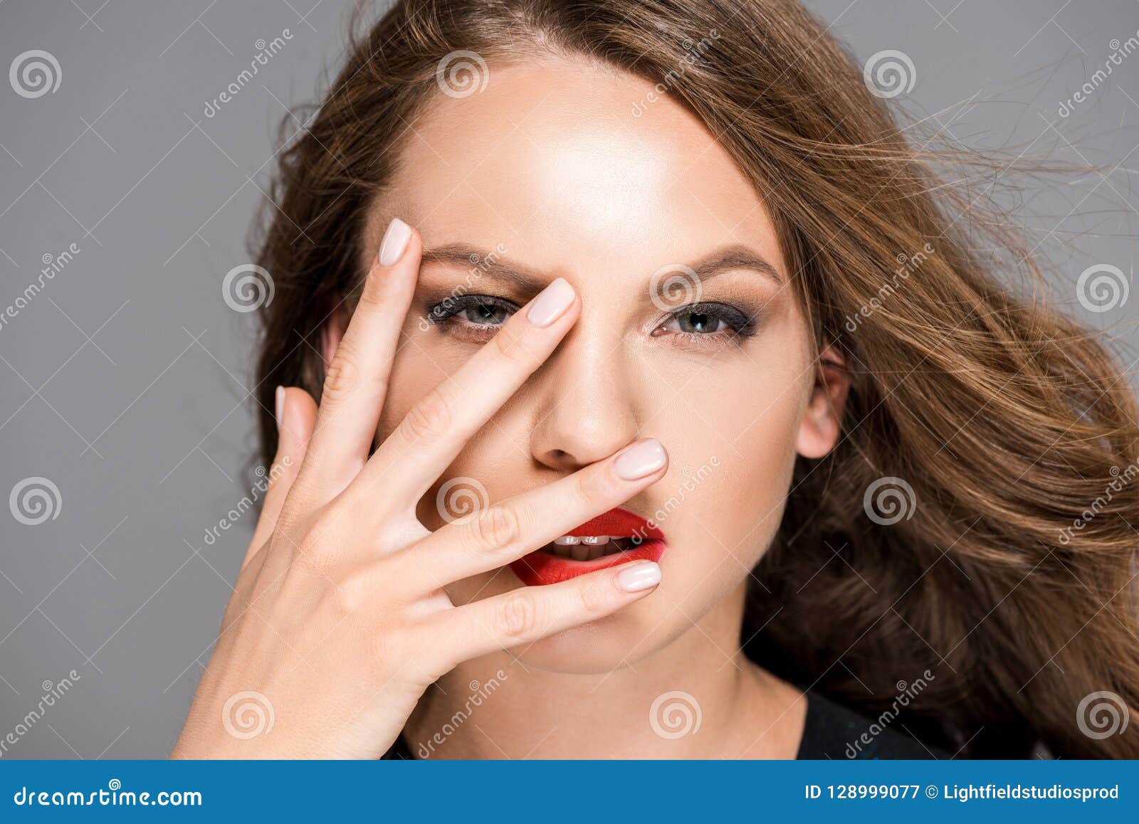 Portrait Of Beautiful Woman With Red Lipstick On Lips Posing Stock