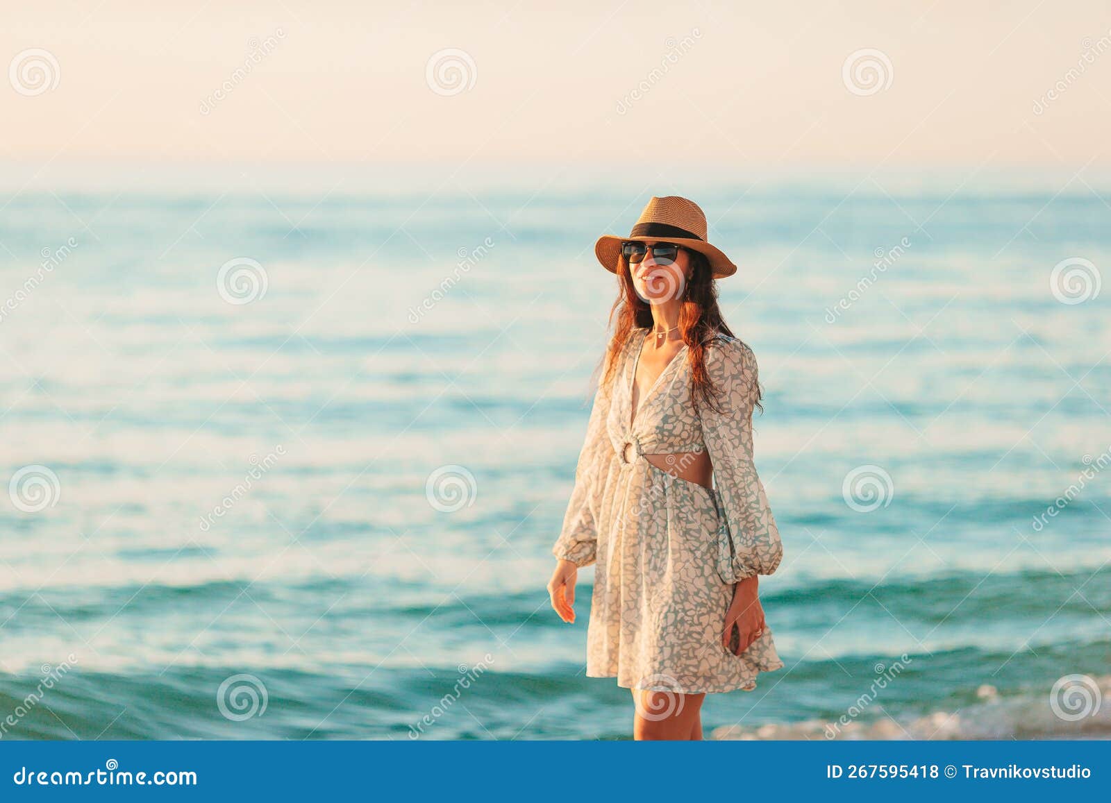 Portrait Of Beautiful Woman At Straw Hat On The Beach At Sunset Stock