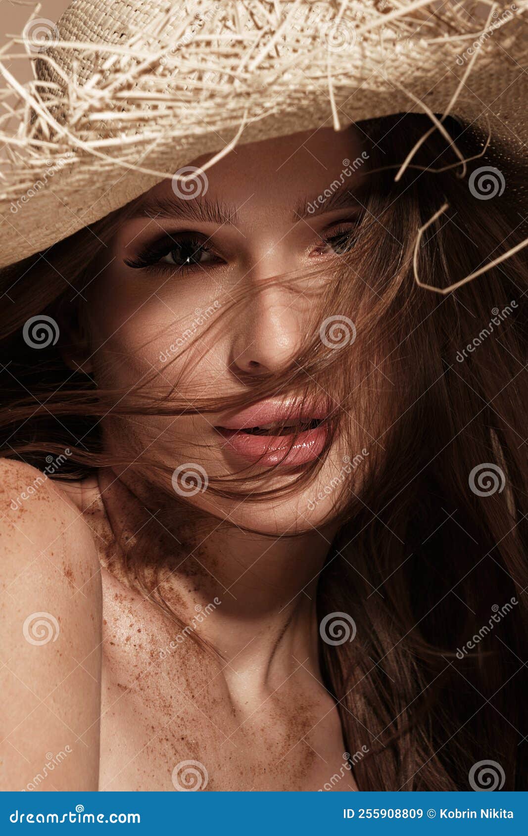 Portrait Of A Beautiful Woman In A Straw Hat Loose Hair And Nude