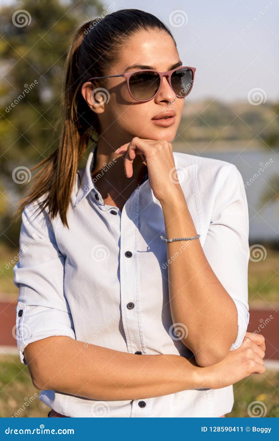 Beautiful Woman Wearing Sunglasses Posing At Outdoor Stock Image