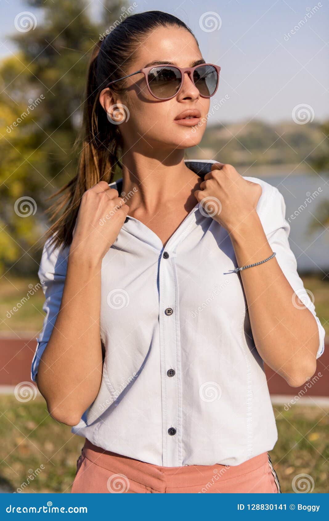Beautiful Woman Wearing Sunglasses Posing At Outdoor Stock Image
