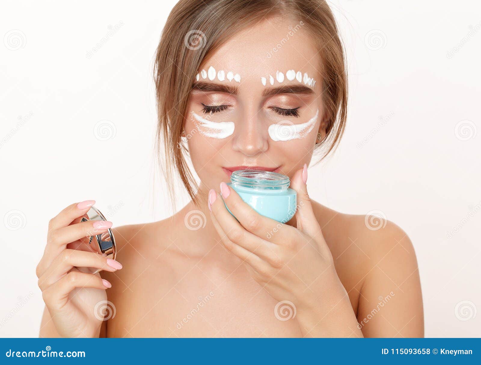 Portrait Of Beautiful Women With Perfect Skin Applying Cream On The