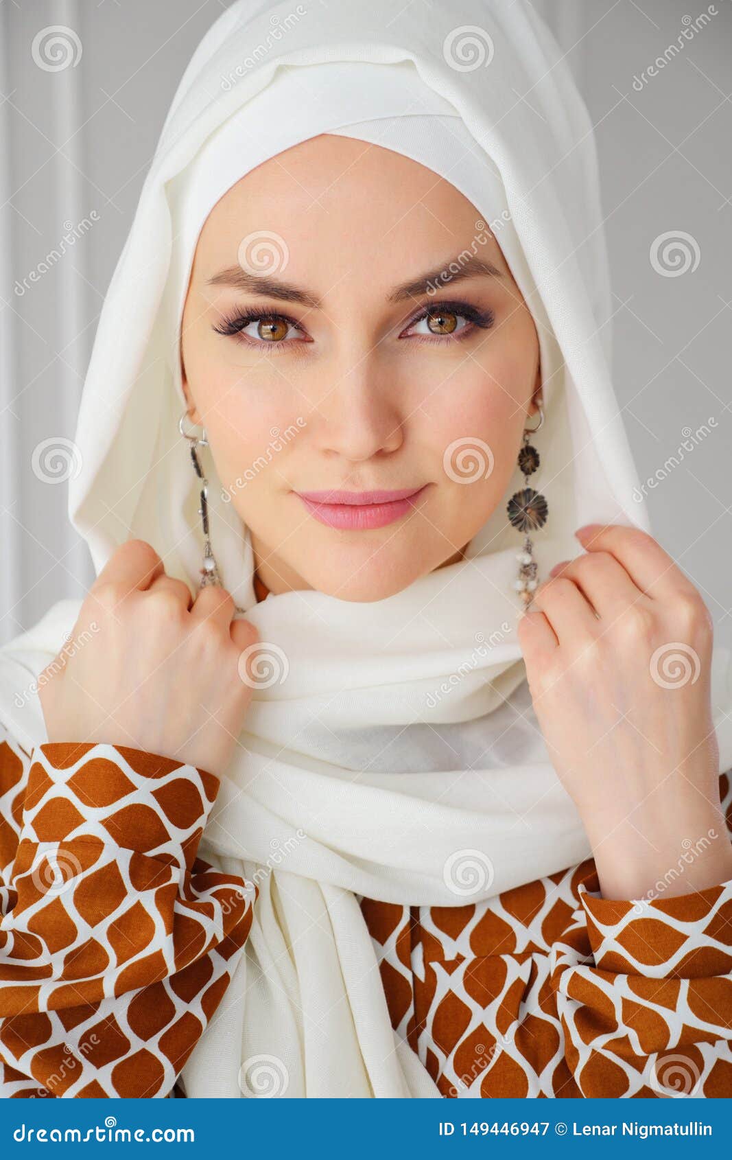 Portrait Of Beautiful Young Muslim Arabian Woman Wearing White Hijab