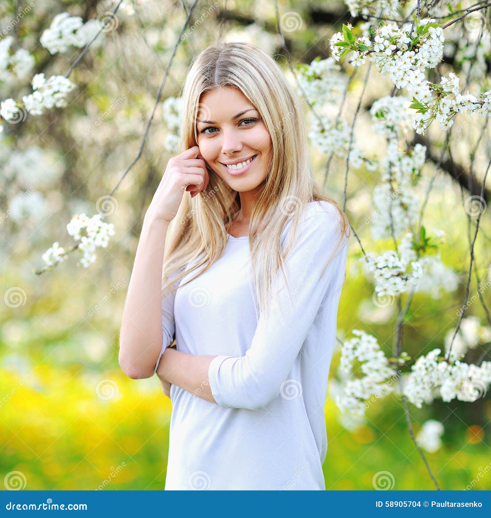 Portrait of a Beautiful Young Smiling Woman in Spring Stock Photo ...