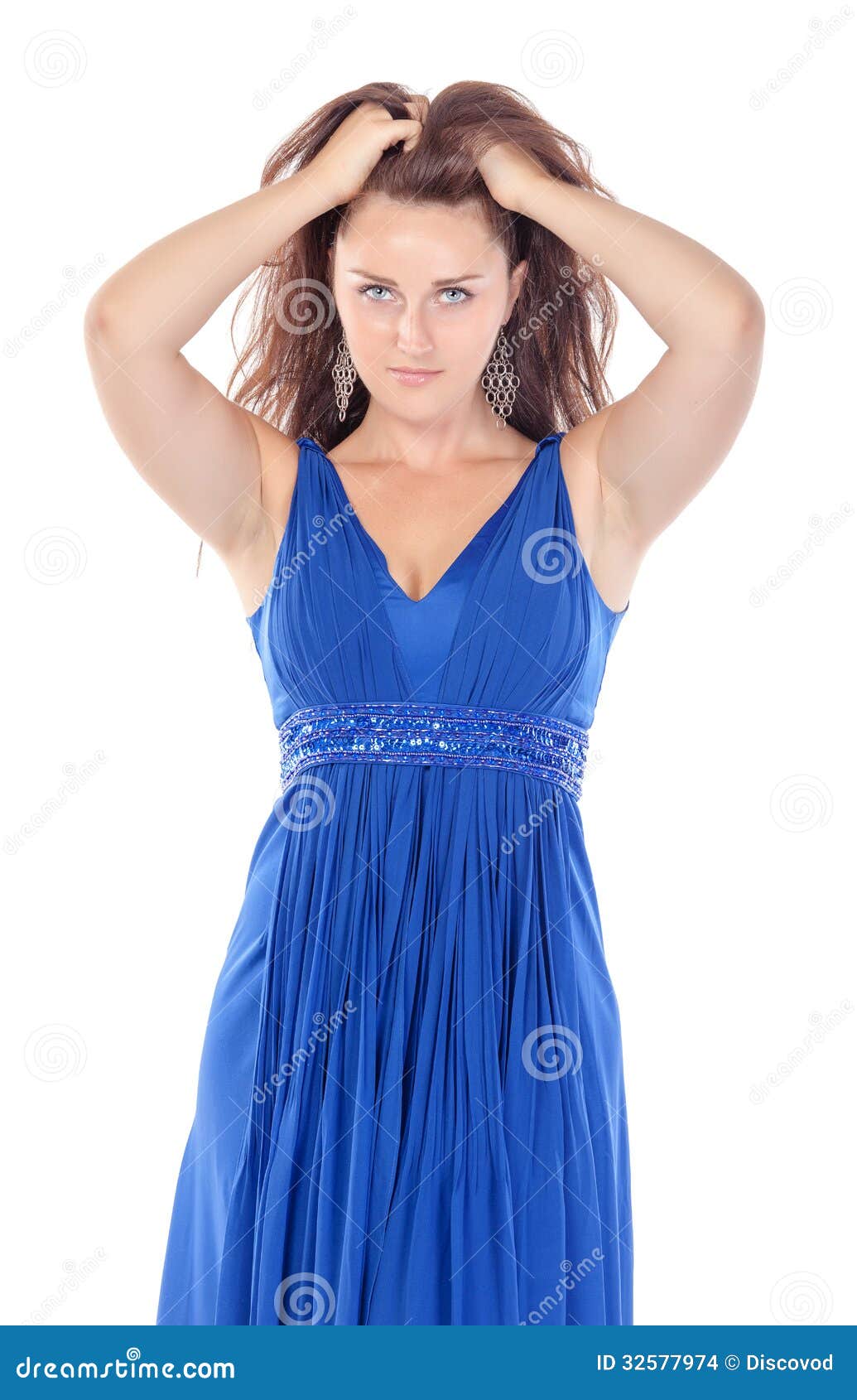 Portrait Of A Beautiful Young Woman In Blue Dress Holding On To Stock