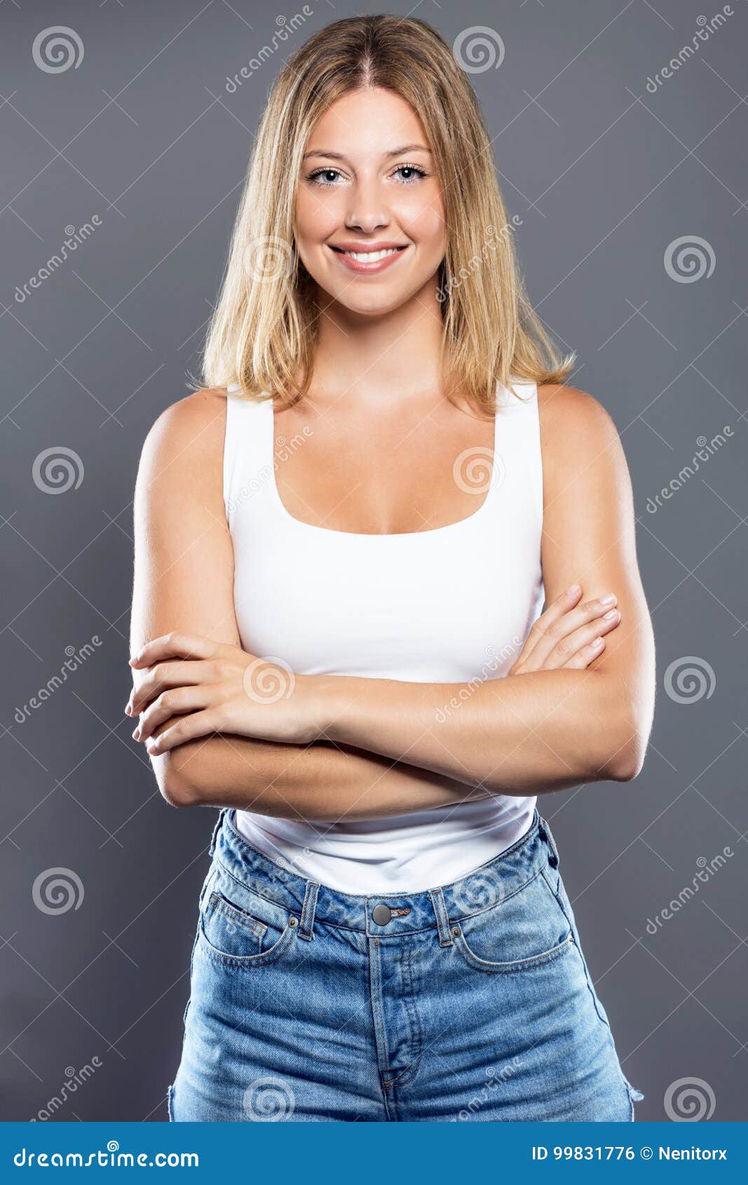 Beautiful Young Woman Looking At Camera Over Gray Background Stock