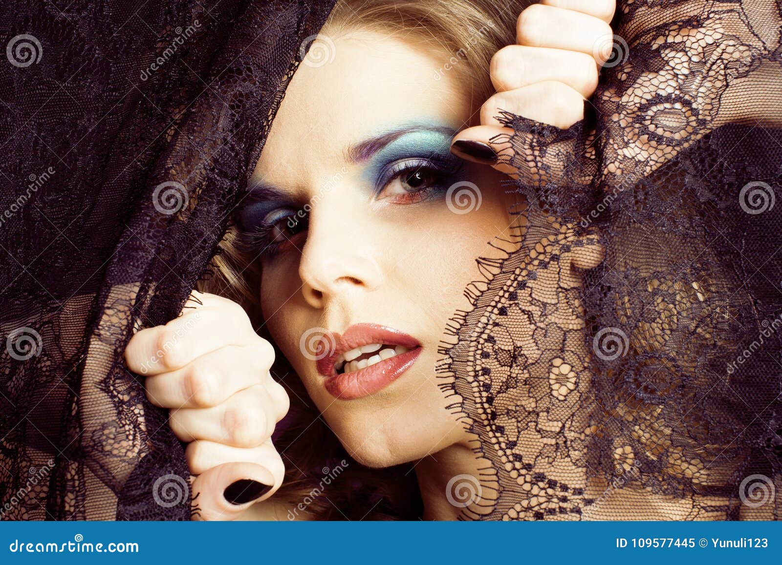 Portrait Of Beauty Blond Young Woman Through Black Lace Stock Image